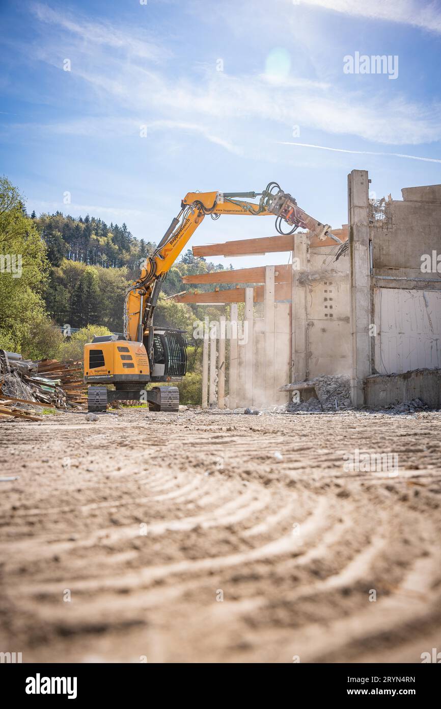 Yellow Liebherr crawler excavator recycling on demolition site Stock ...
