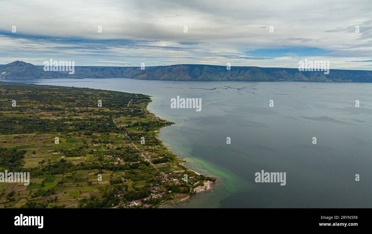 Aerial drone of Lake Toba on the island of Sumatra in Indonesia, is the ...