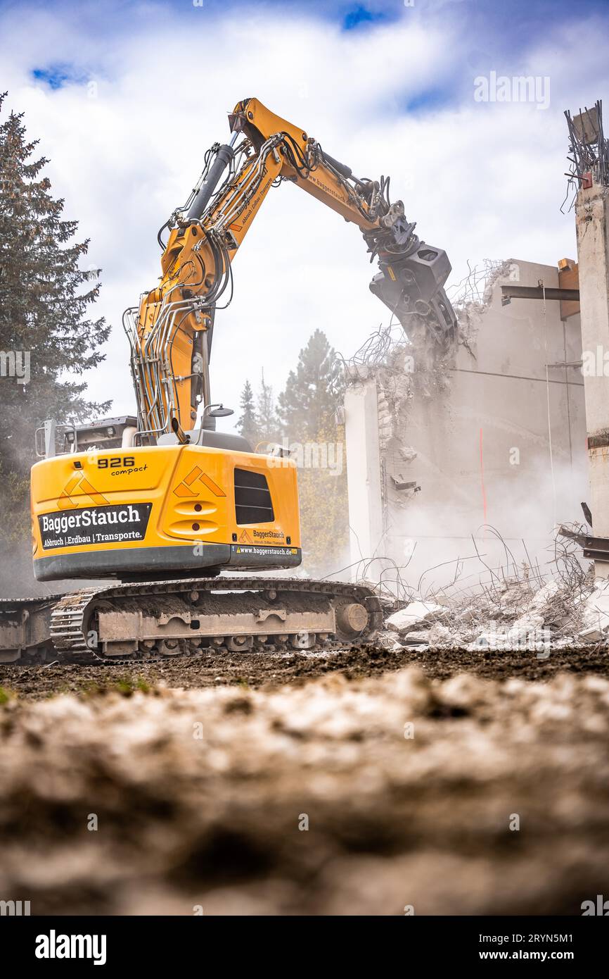 Yellow Liebherr crawler excavator recycling on demolition site Stock ...