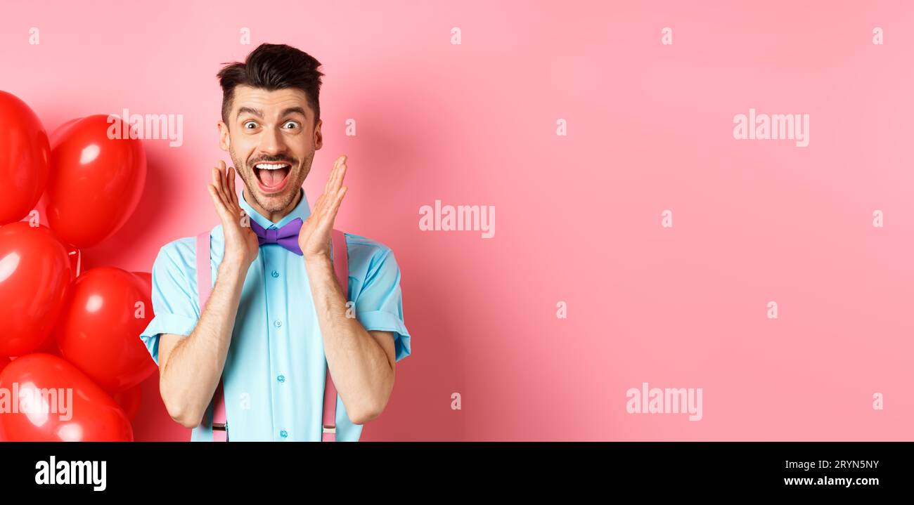 Love and romance concept. Happy man screaming from fantastic news ...