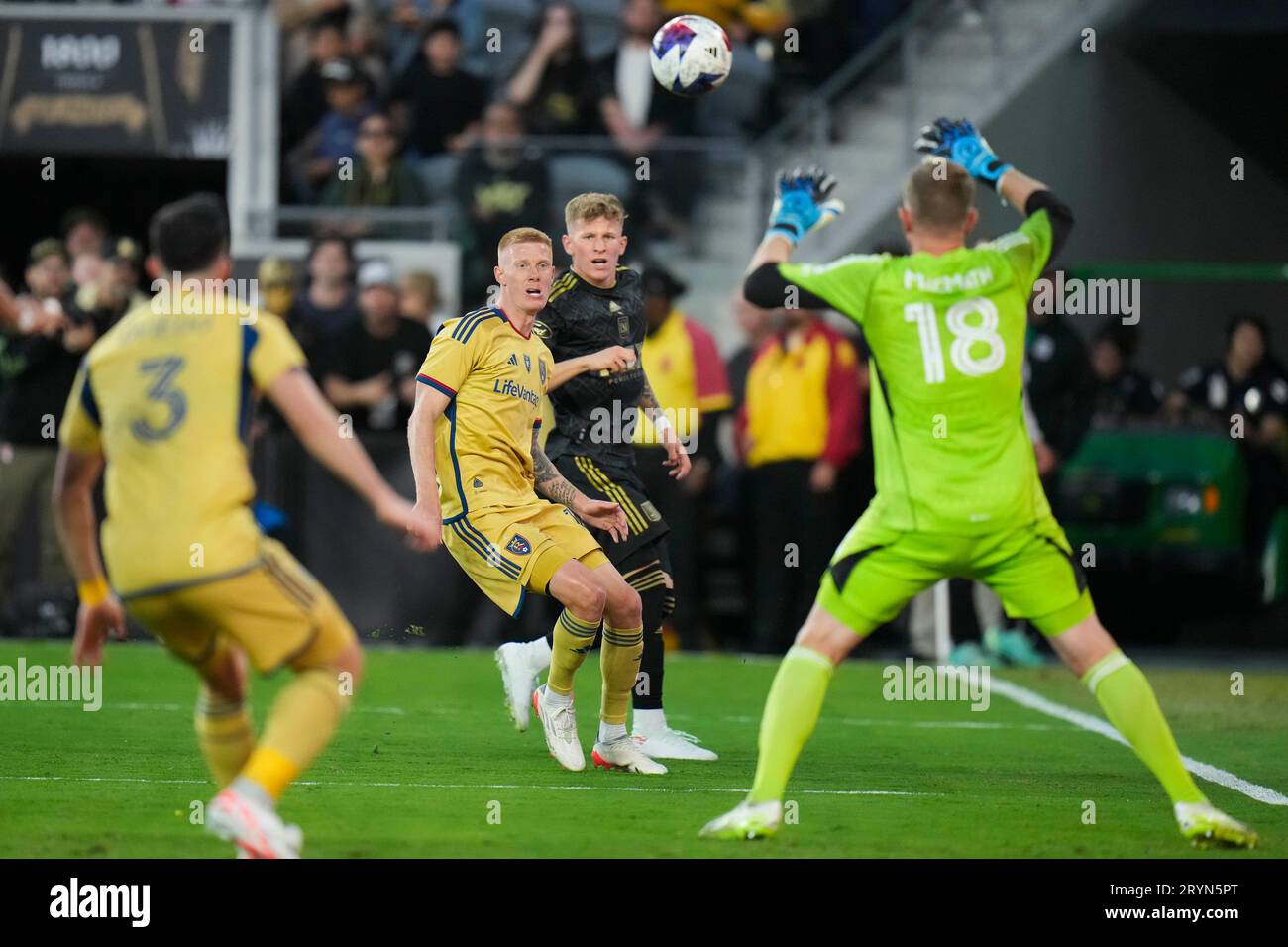 Los Angeles FC midfielder Mateusz Bogusz, center right, watches his ...