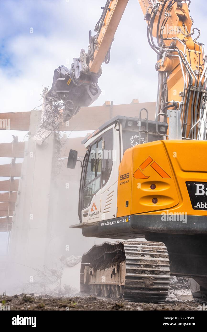 Yellow Liebherr crawler excavator recycling on demolition site Stock ...