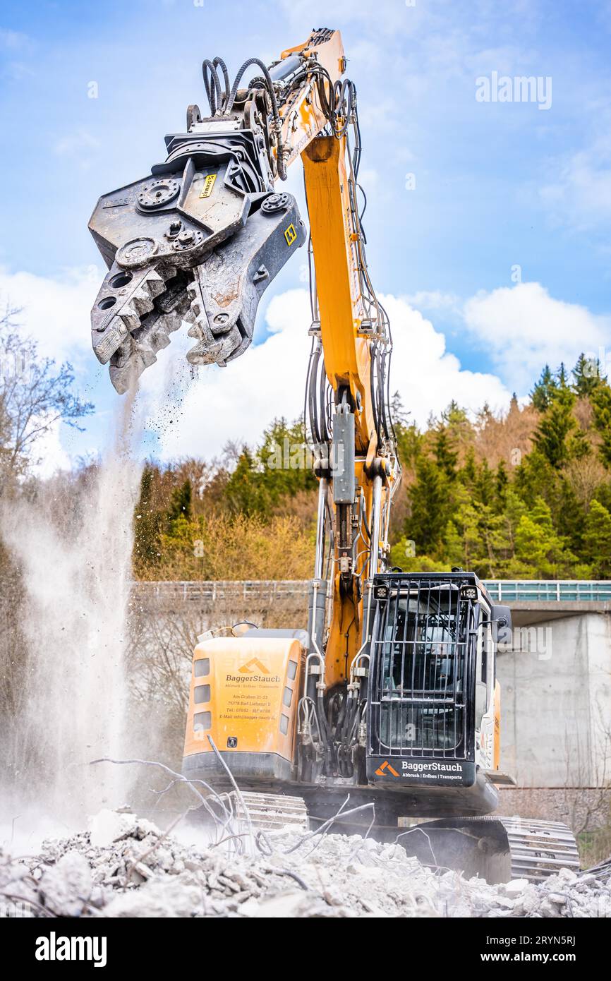 Yellow Liebherr crawler excavator recycling on demolition site Stock ...