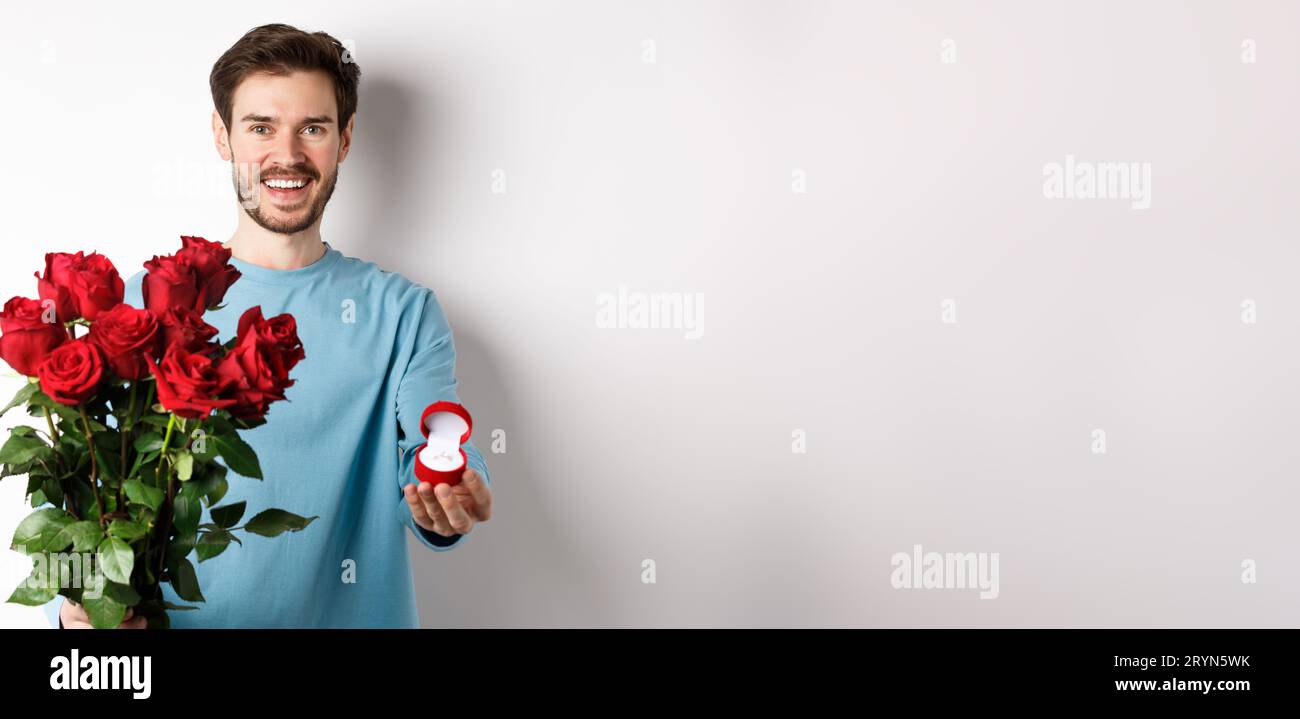 Handsome young man boyfriend making a proposal on Valentines lovers day ...