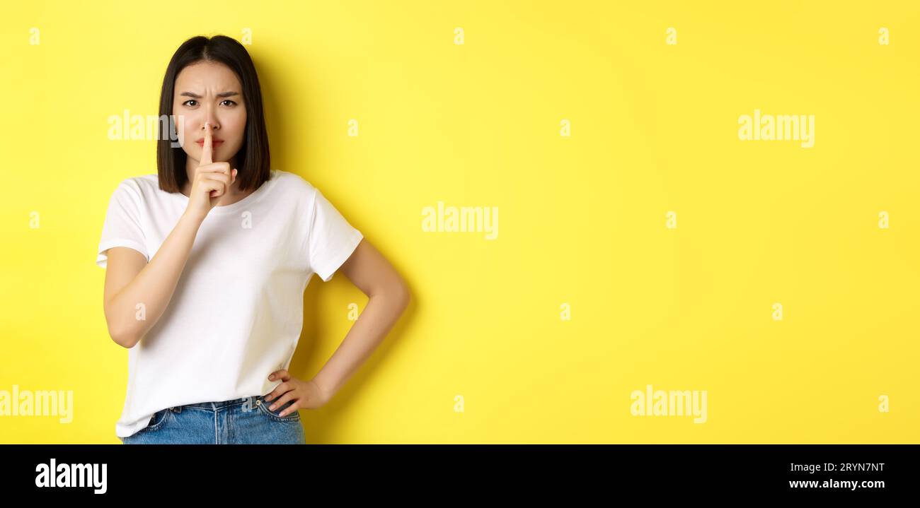 Beauty and fashion concept. Angry and bossy asian girl telling to be ...