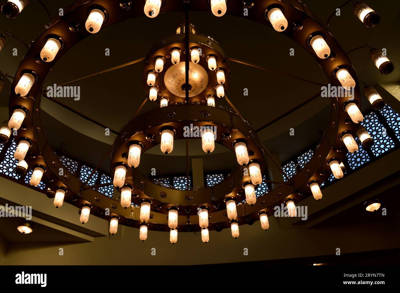 A large circular mosque chandelier ceiling light with lamps and made of ...