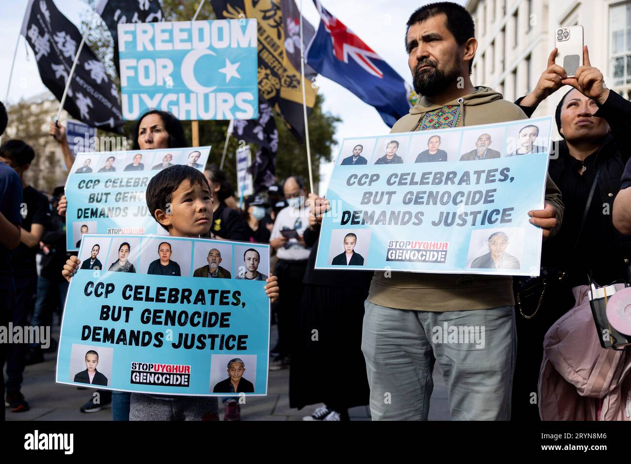 London, UK. 01st Oct, 2023. A young protester is seen holding a placard ...