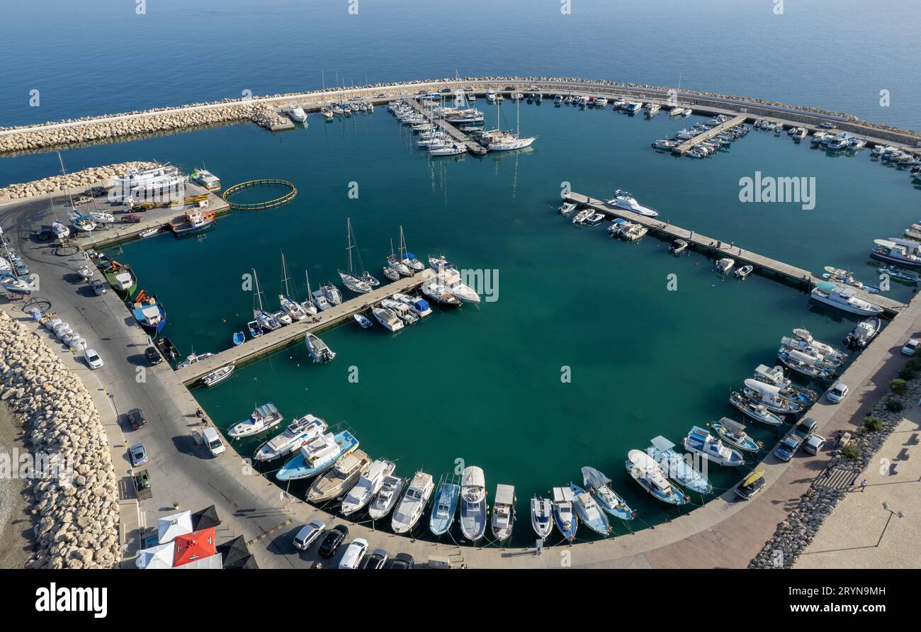 Drone aerial scenery of a fishing port. Fishing boats and yachts moored ...