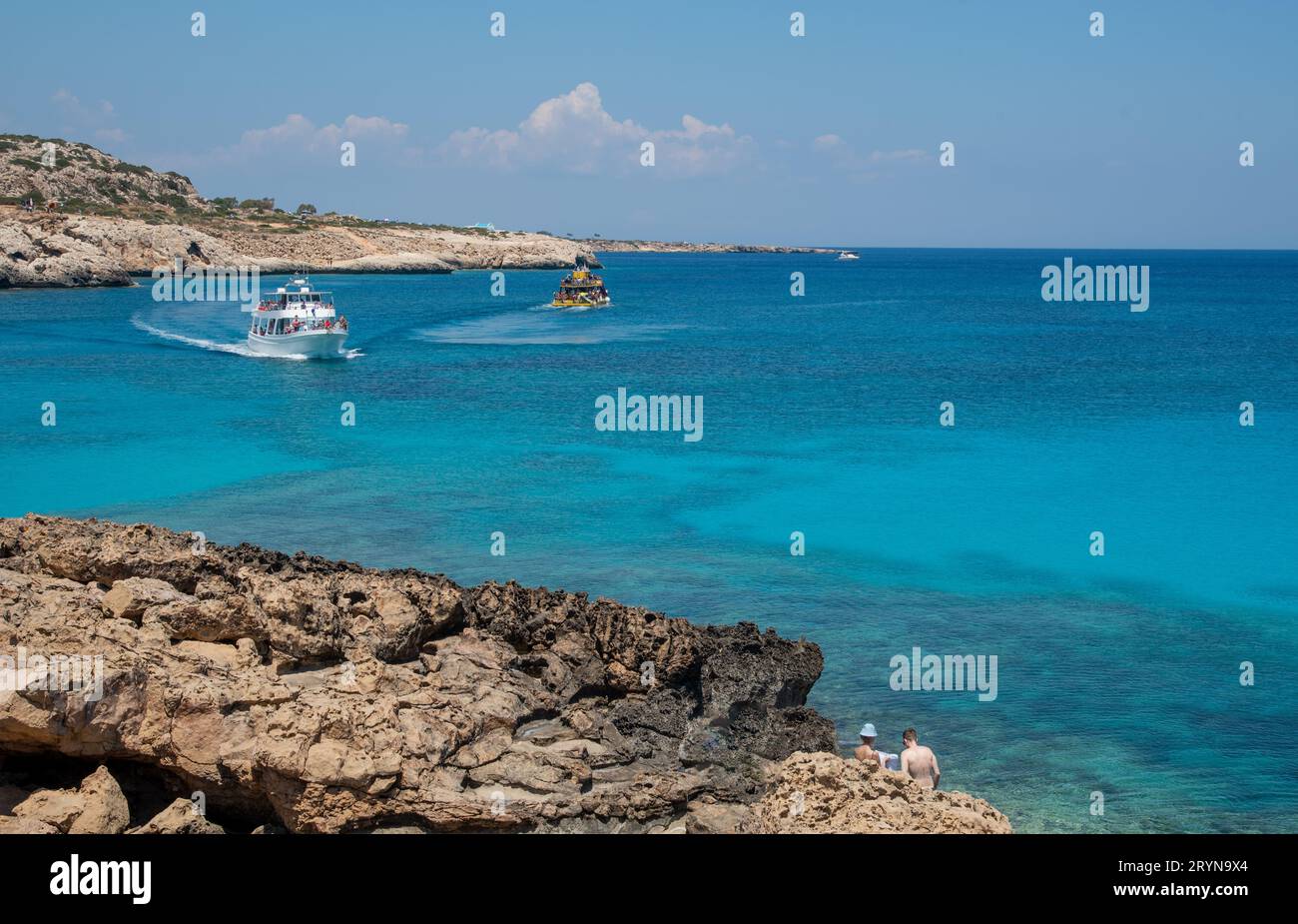 Tourist yachts with people sailing in the sea. Summer holidays in the ...