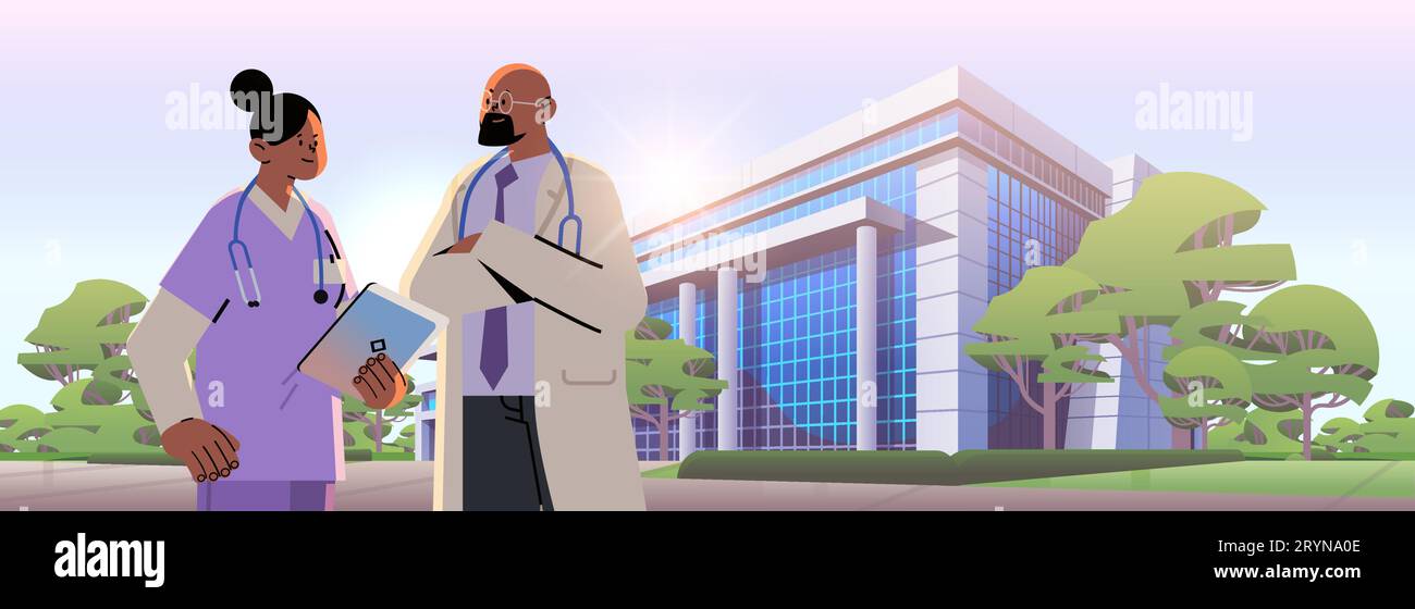 man woman doctors with stethoscopes walking near hospital building ...