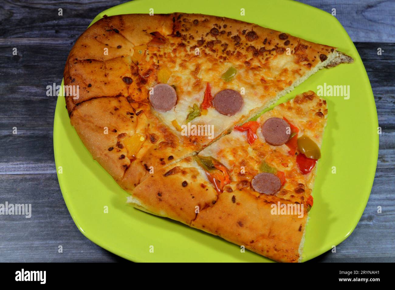 Cheese Fougasse topped with slices of green peppers, cheese, and cut ...