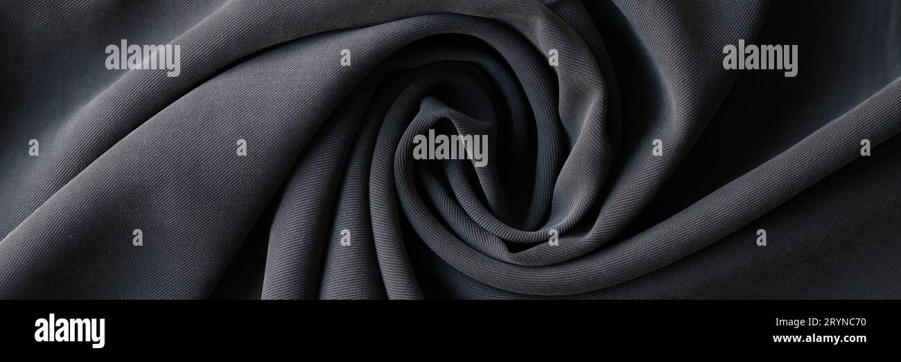 Rolled dark grey fabric sample in textile store or atelier Stock Photo ...