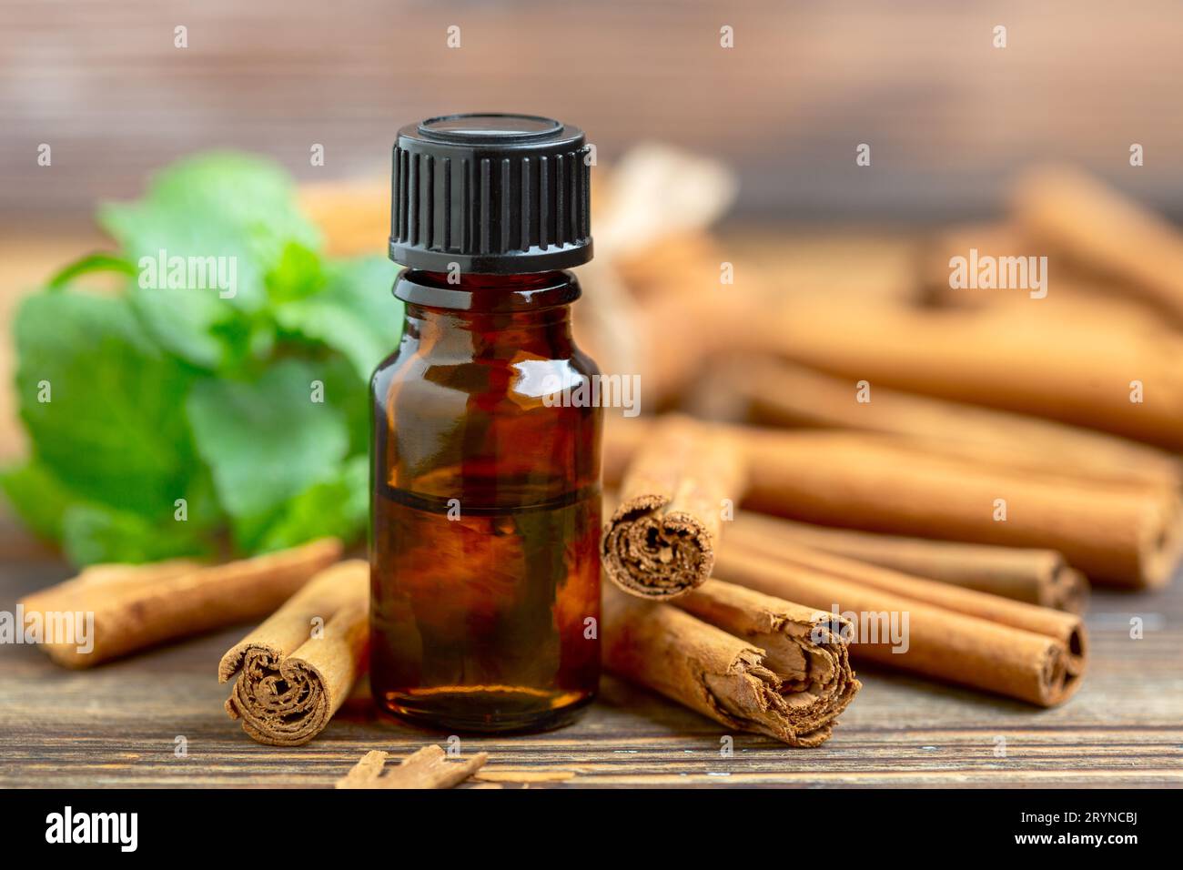 Cinnamon essential oil for SPA Stock Photo - Alamy