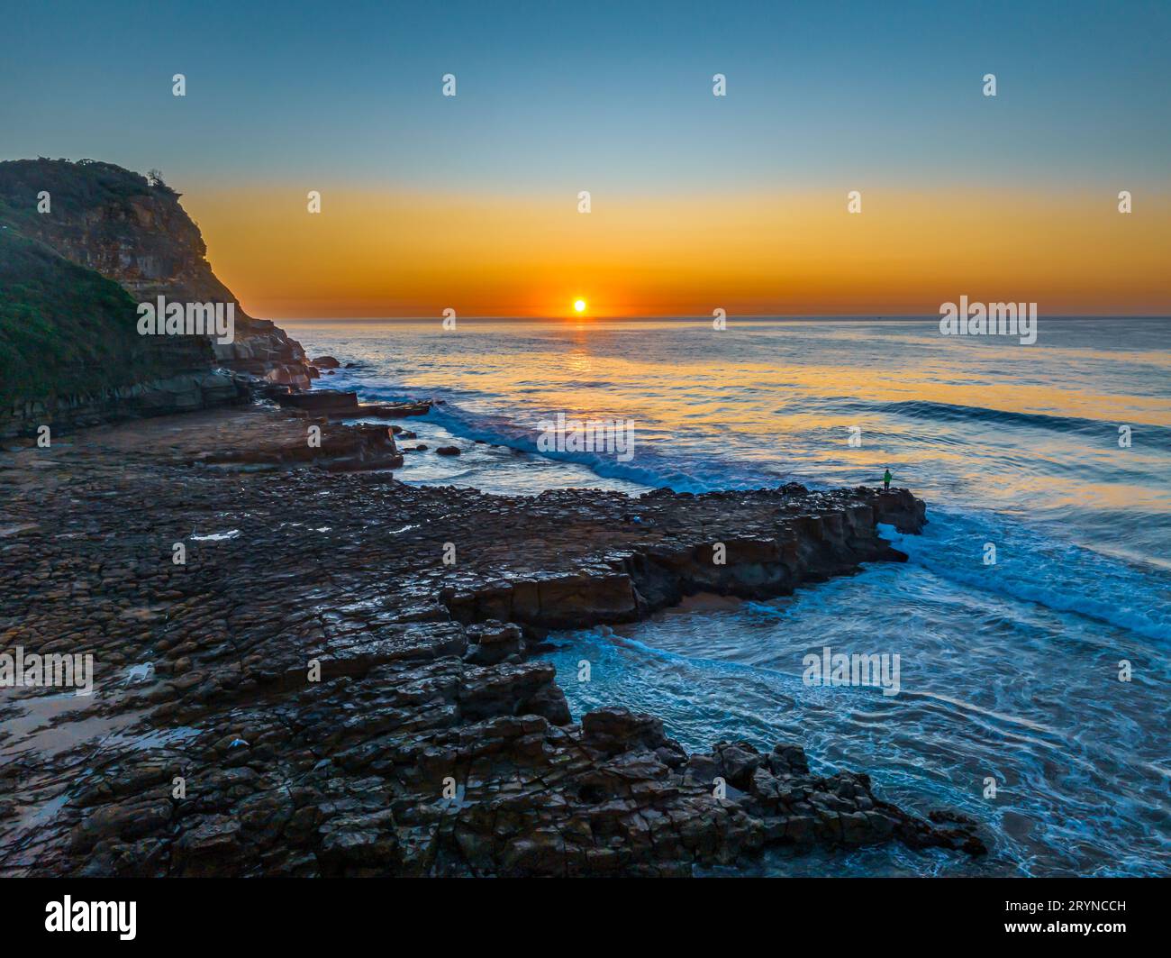 Sunrise seascape with tessellated rock platform at North Avoca on the ...