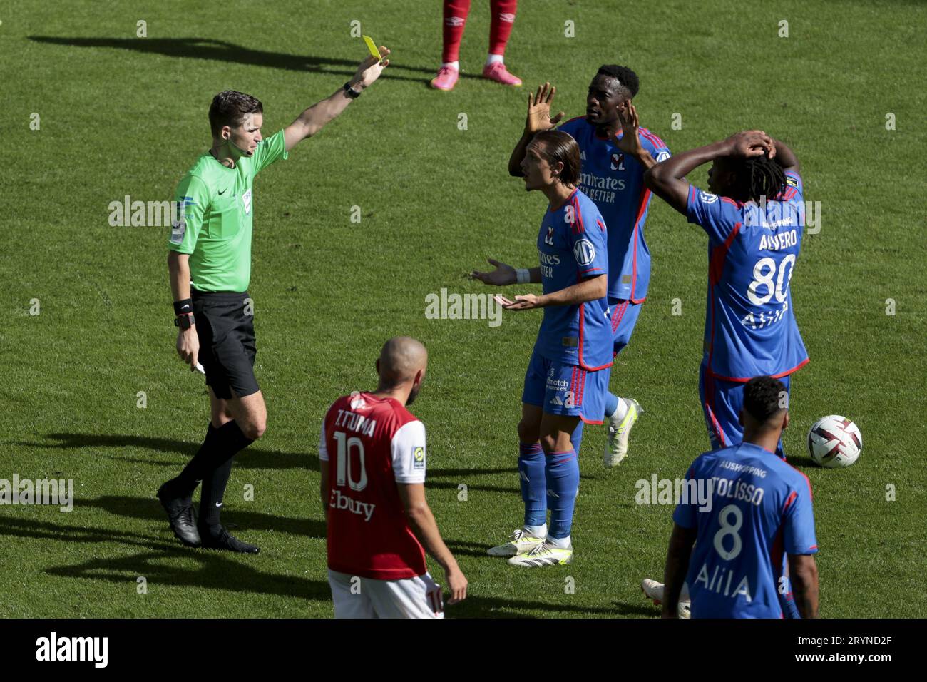 Referee Francois Letexier gives a yellow card to Maxence Caqueret of ...