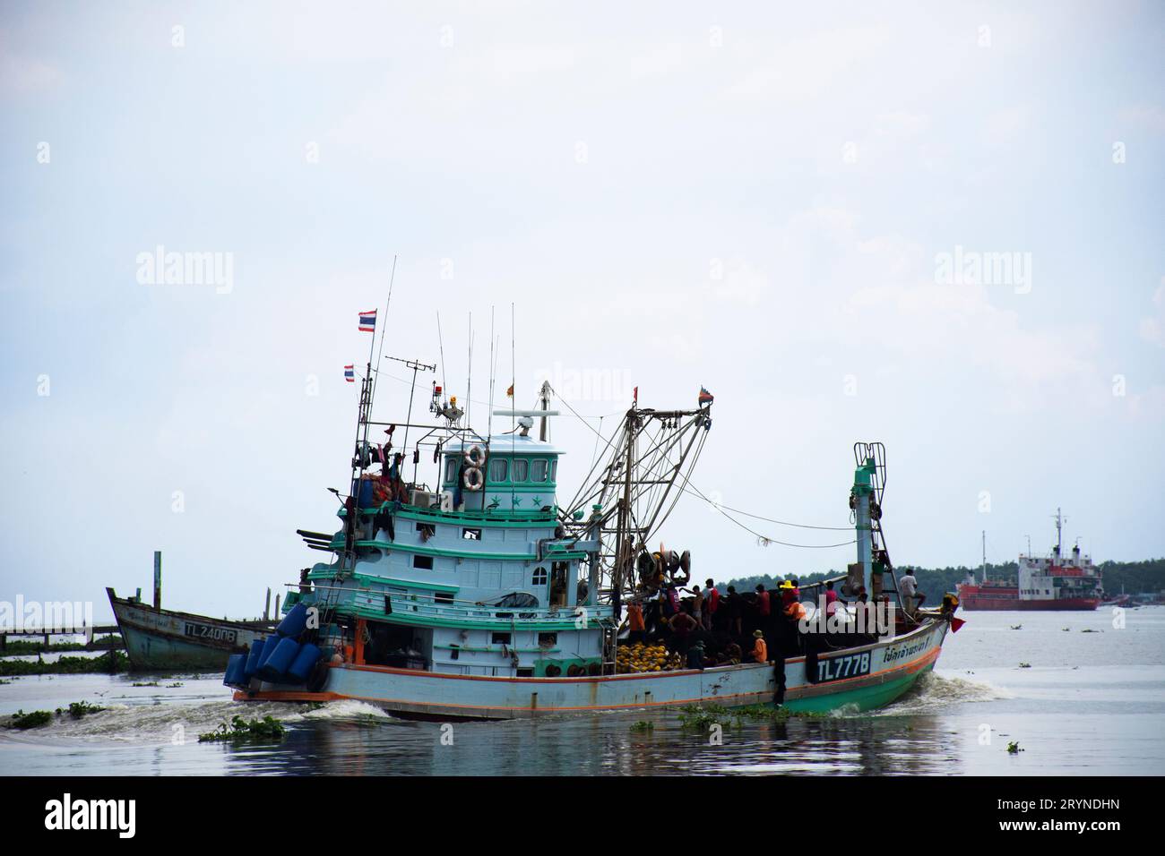 Thai fisher worker people sail fishing boat ship in sea after catch ...