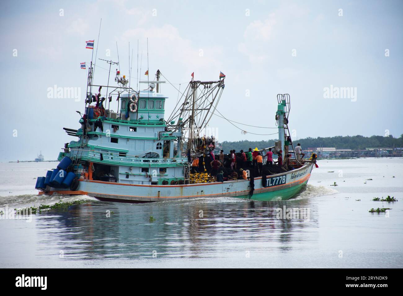 Thai fisher worker people sail fishing boat ship in sea after catch ...