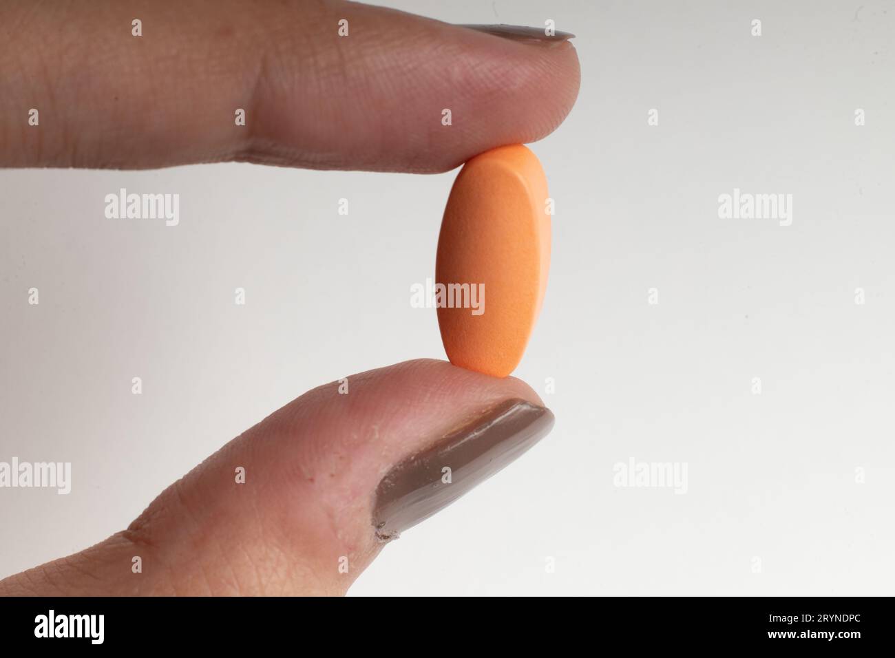 closeup of Colorful tablets in hand isolated on white background Stock ...