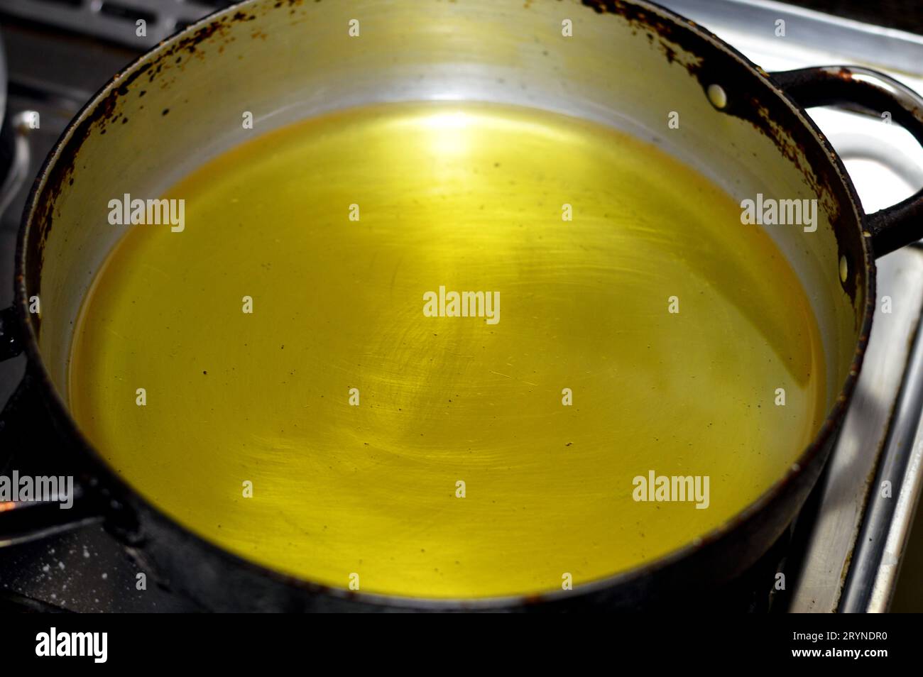 food oil in a pan ready for frying fast food, mixture of sunflower ...