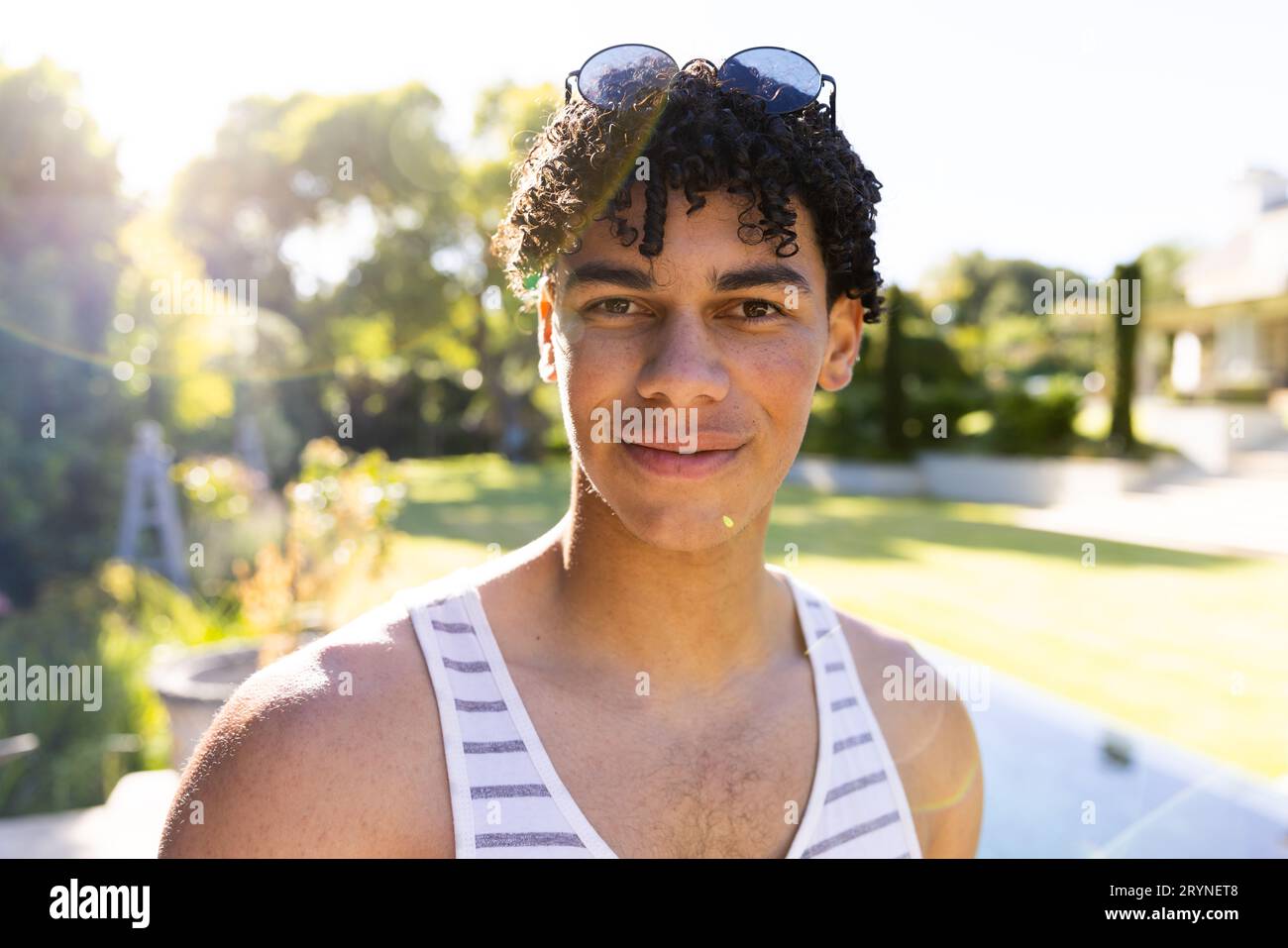 Close-up portrait of handsome biracial young man with sunglasses posing ...