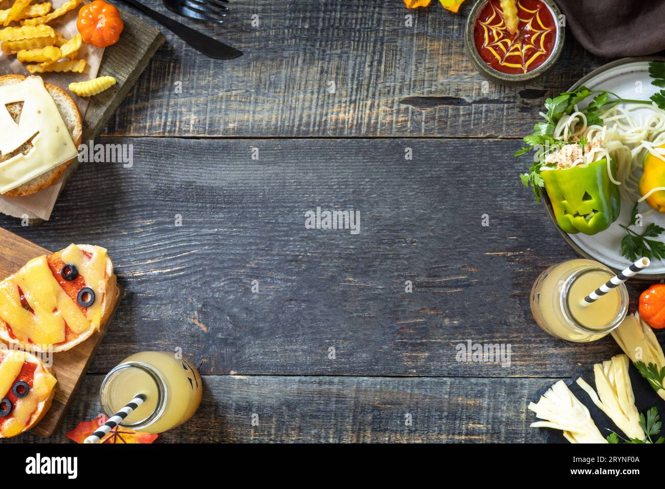 Halloween party food corner table scene over a wood background ...