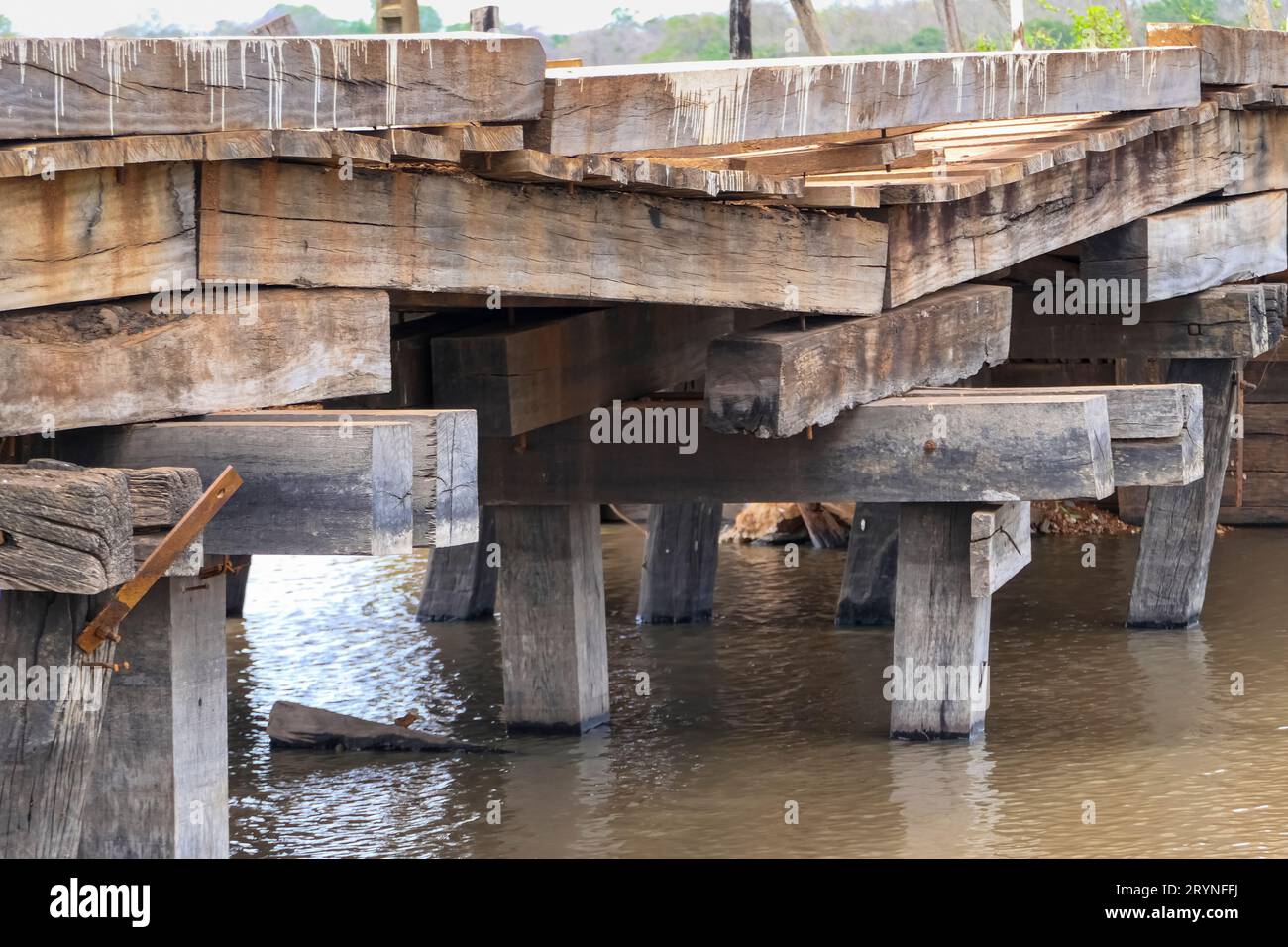 Run-down wooden bridge of the Transpantaneira crossing a river ...