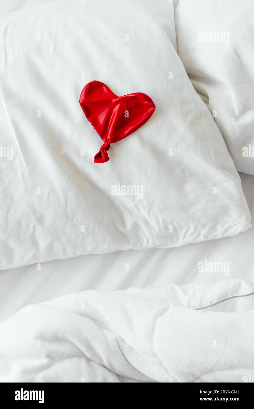 Deflated red balloon hi-res stock photography and images - Alamy