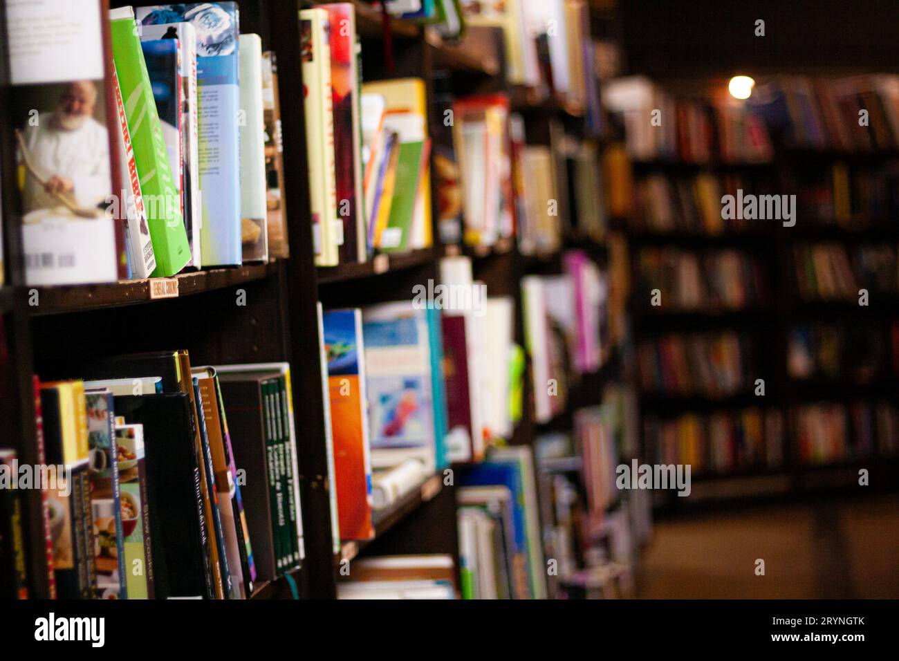 Books on the shelf of a cozy bookstore Stock Photo - Alamy