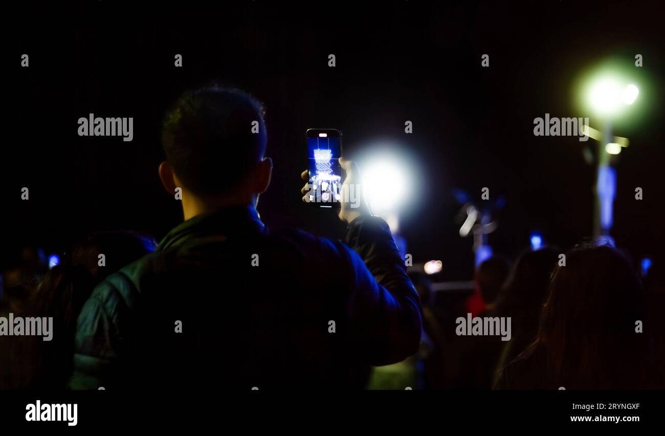 Adult man taking video photos hi-res stock photography and images - Alamy