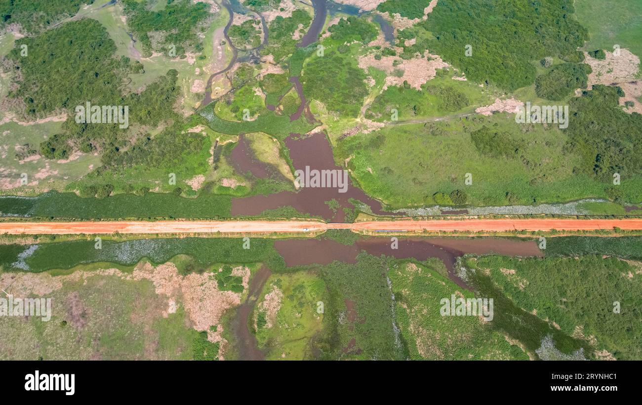 Aerial view of Transpantaneira dirt road crossing in typical Pantanal ...