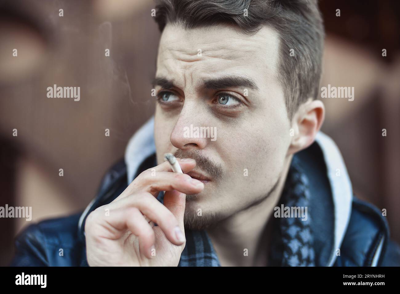 The guy is depressed from nicotine addiction Stock Photo - Alamy