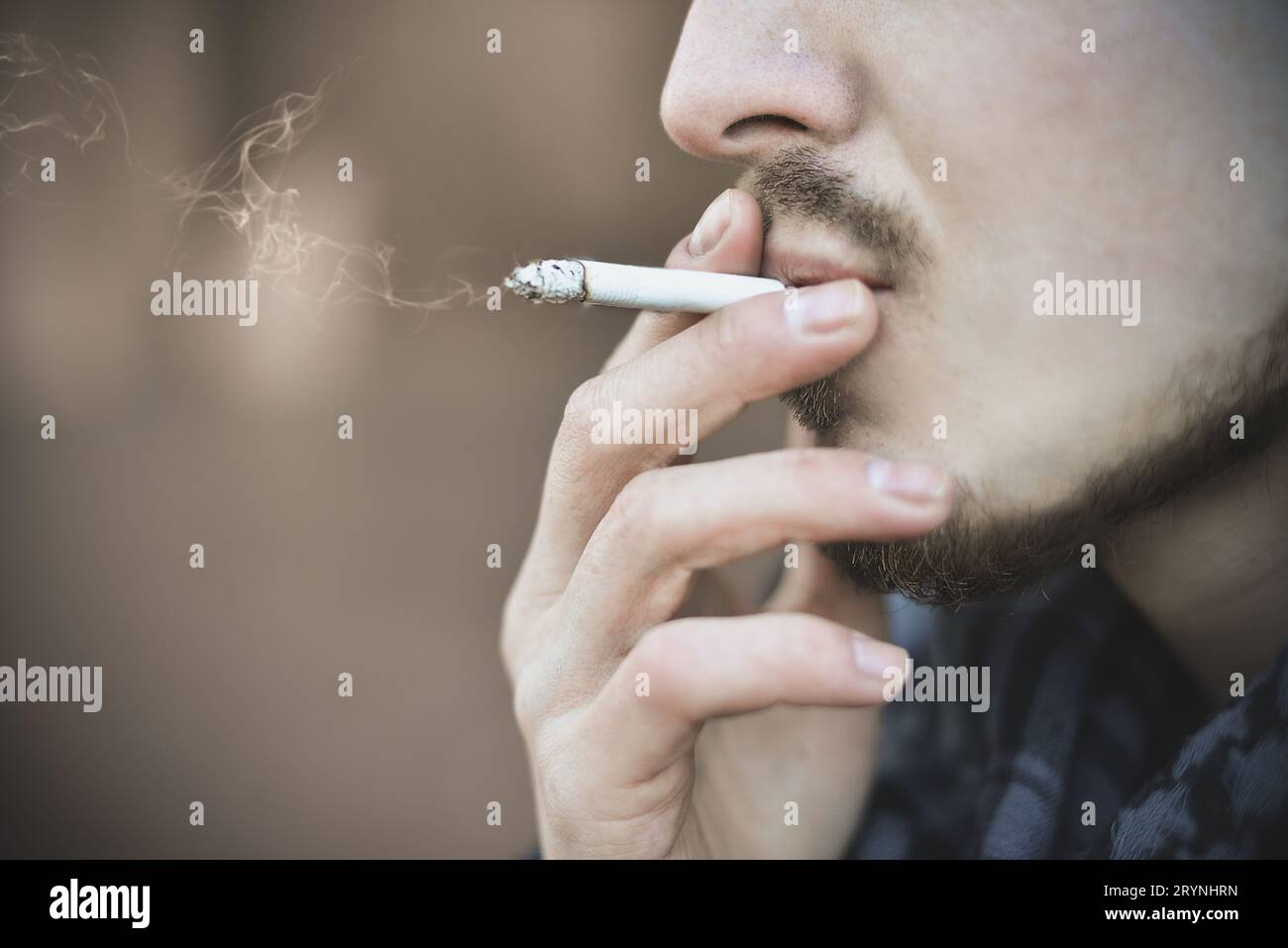 The guy is depressed from nicotine addiction Stock Photo - Alamy