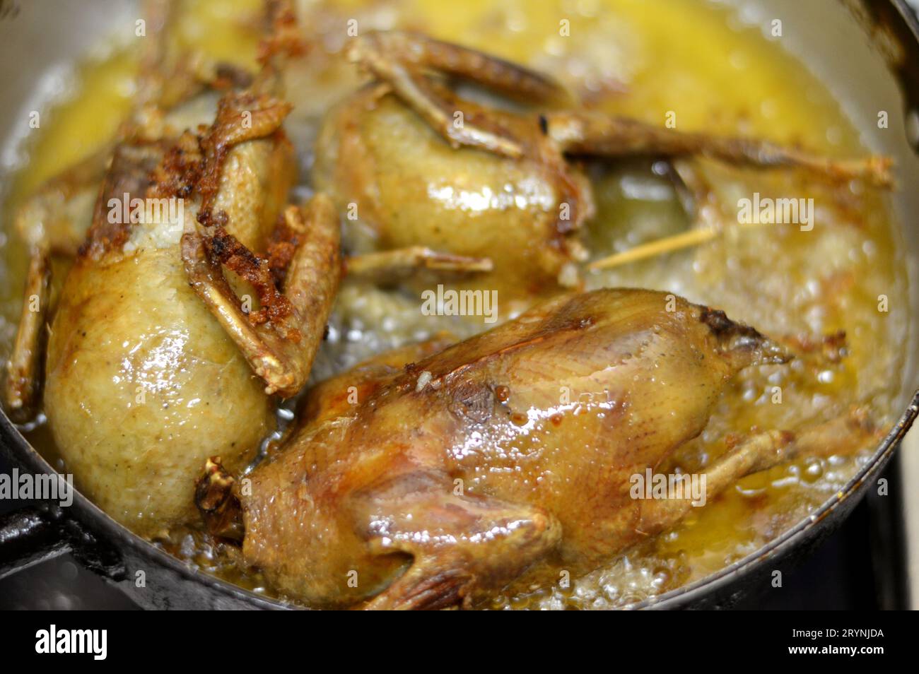 Frying and roasting pigeons stuffed with white rice or Hamam mahshi ...