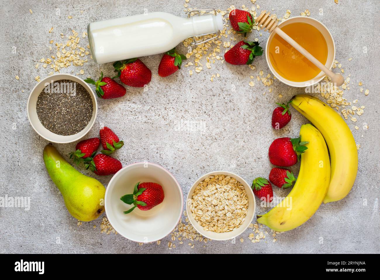 Healthy breakfast ingredients: Oatmeal, honey, fruit, strawberry Stock ...