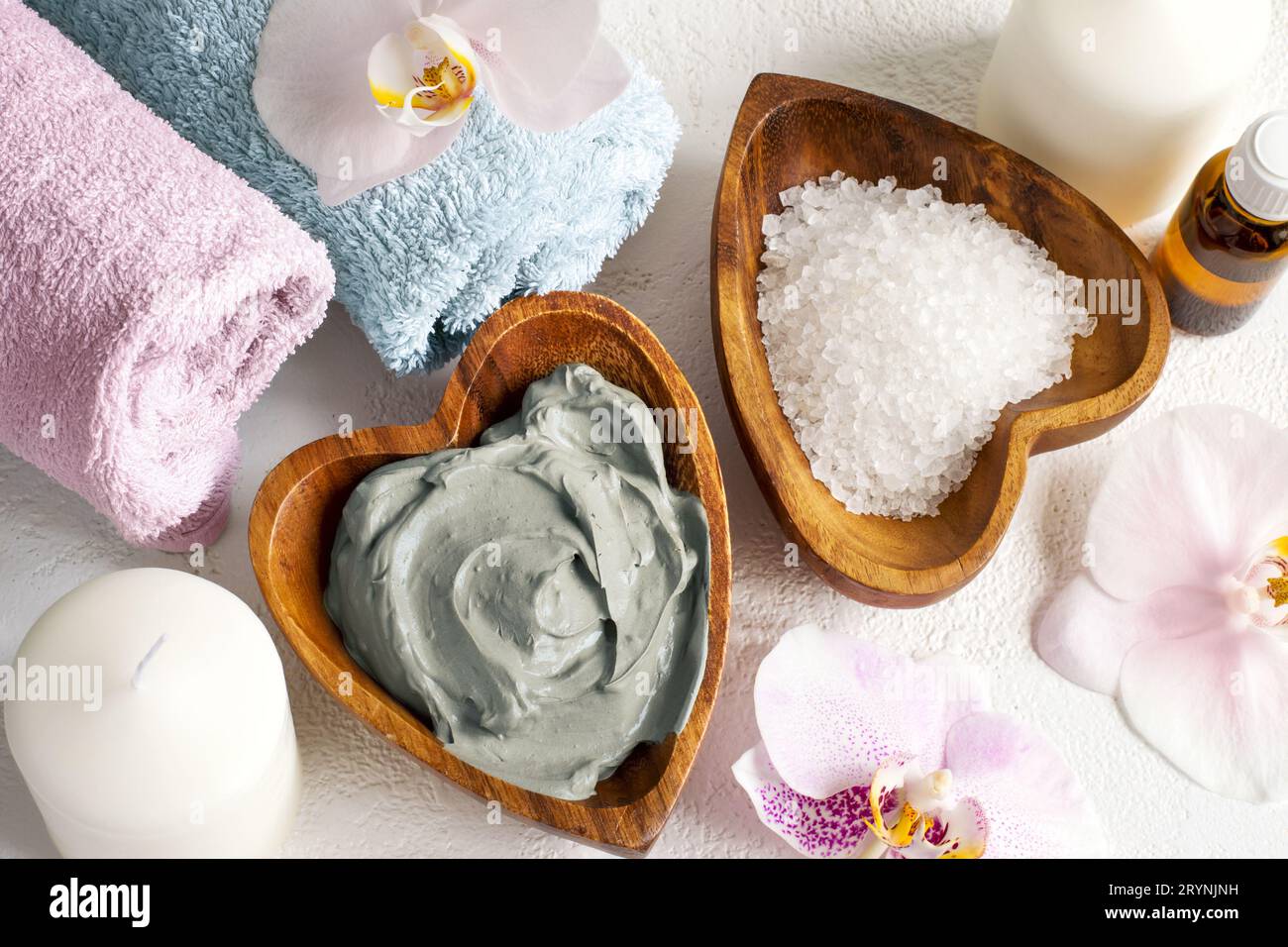 Spa setting. Cosmetic body mask made of blue clay, sea salt Stock Photo ...