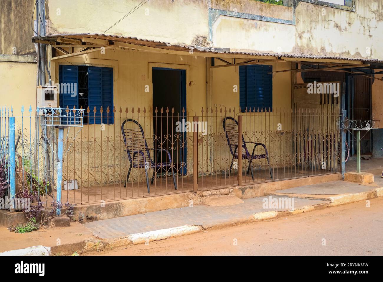 Typical fenced veranda of a yelllow house in PoconÃ©, Mato Grosso ...