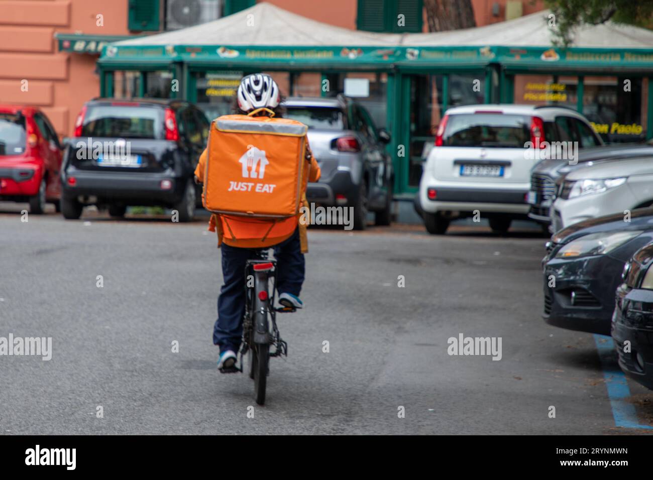Milan, Italy - 09 18 2023 : just eat sign brand and orange text logo on ...