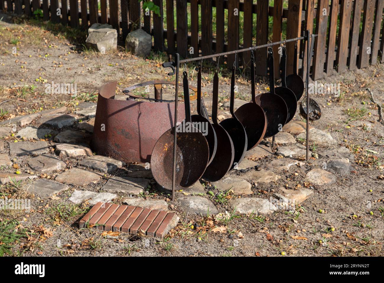 steel pan hanging outside in front of wildwest house with cowboy ...