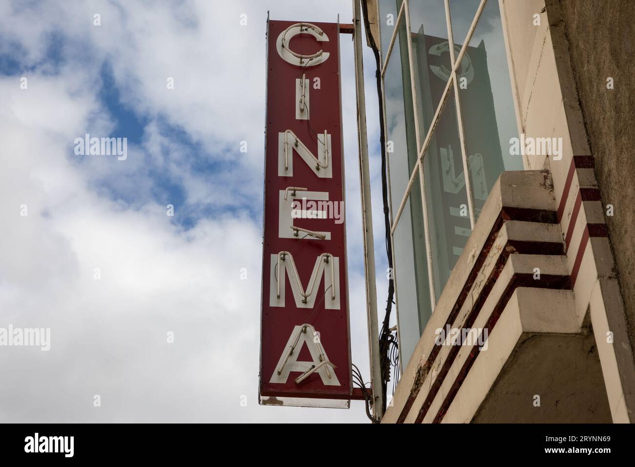 old cinema text sign on facade entrance wall building Stock Photo - Alamy
