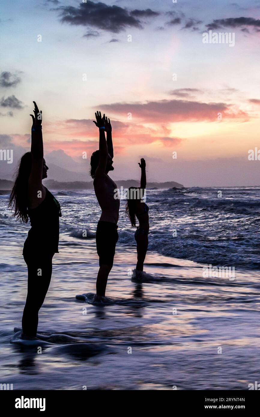 Relaxing time during sunset on Colombian beach Stock Photo - Alamy