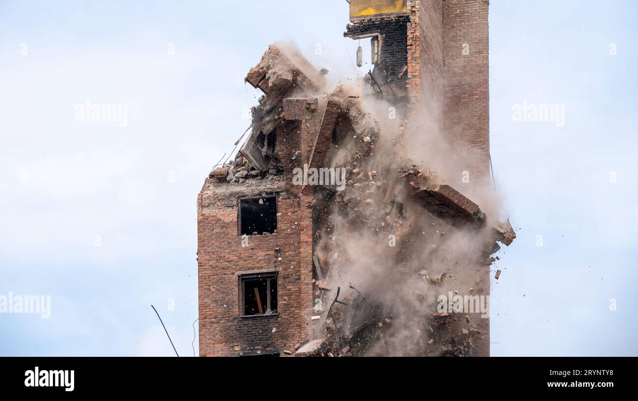 Hit and explosion of a combat military missile in a residential ...