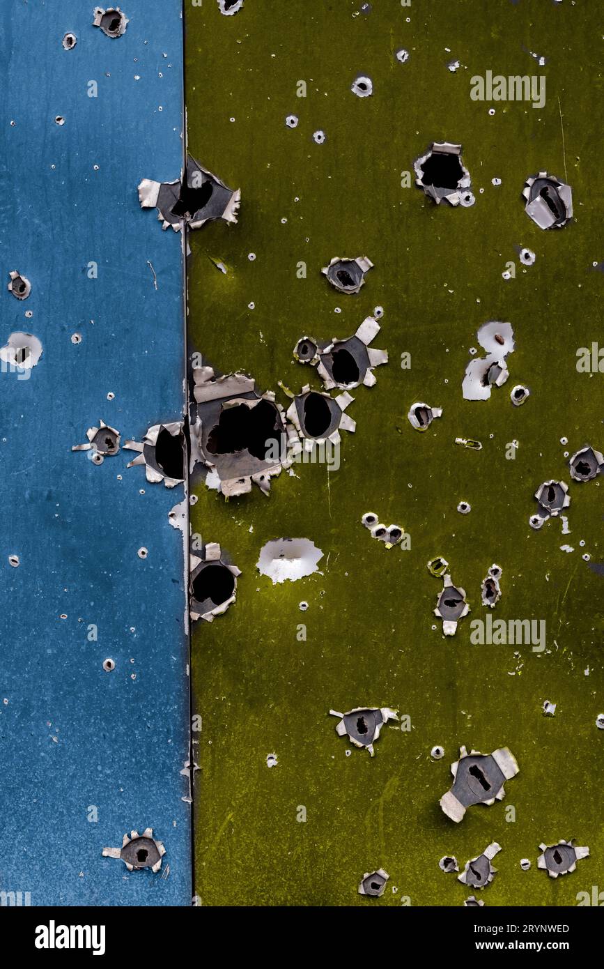 Pattern explosion damaged blue yellow house wall Stock Photo - Alamy