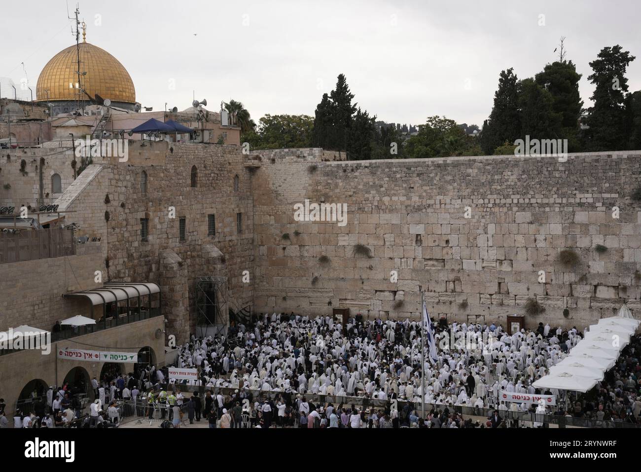 Jews wearing prayer shawls pray during the weeklong Jewish holiday of ...