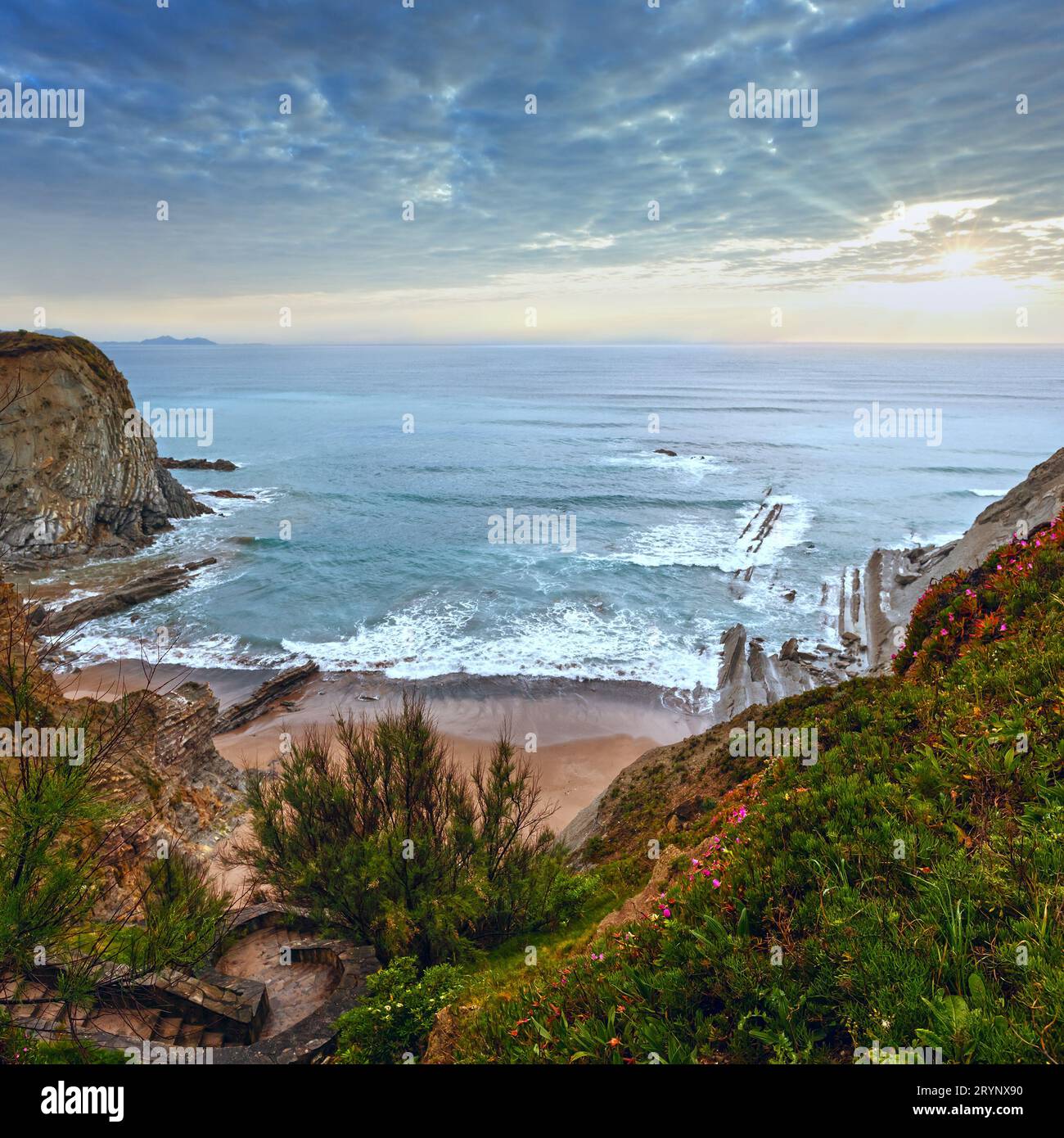 Spring sunset ocean coast Stock Photo - Alamy