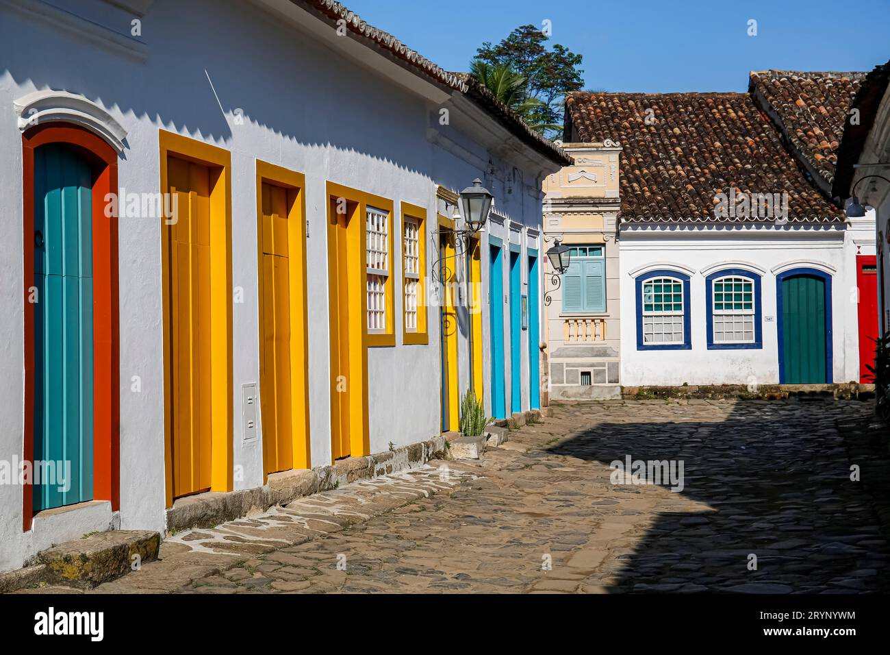 Typical cobblestone street with colorful colonial buildings in the late ...