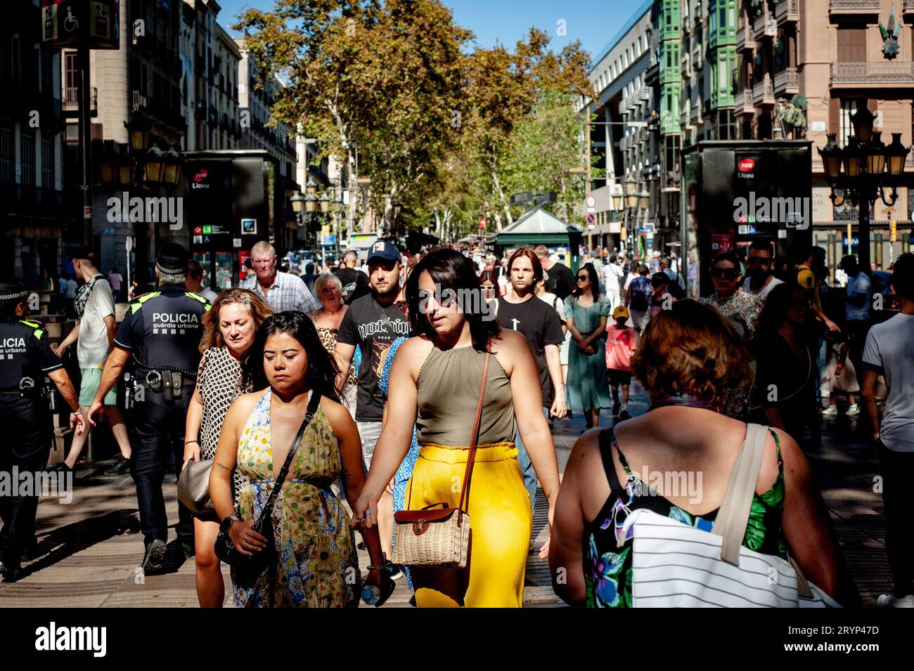 Tourists walk down La Rambla in Barcelona Stock Photo - Alamy