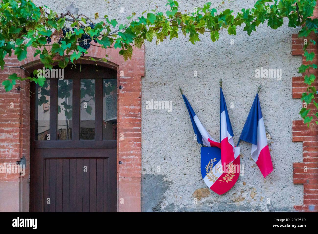 flags of the republic on a facade, Vals, Midi-Pyrénées, Ariège ...