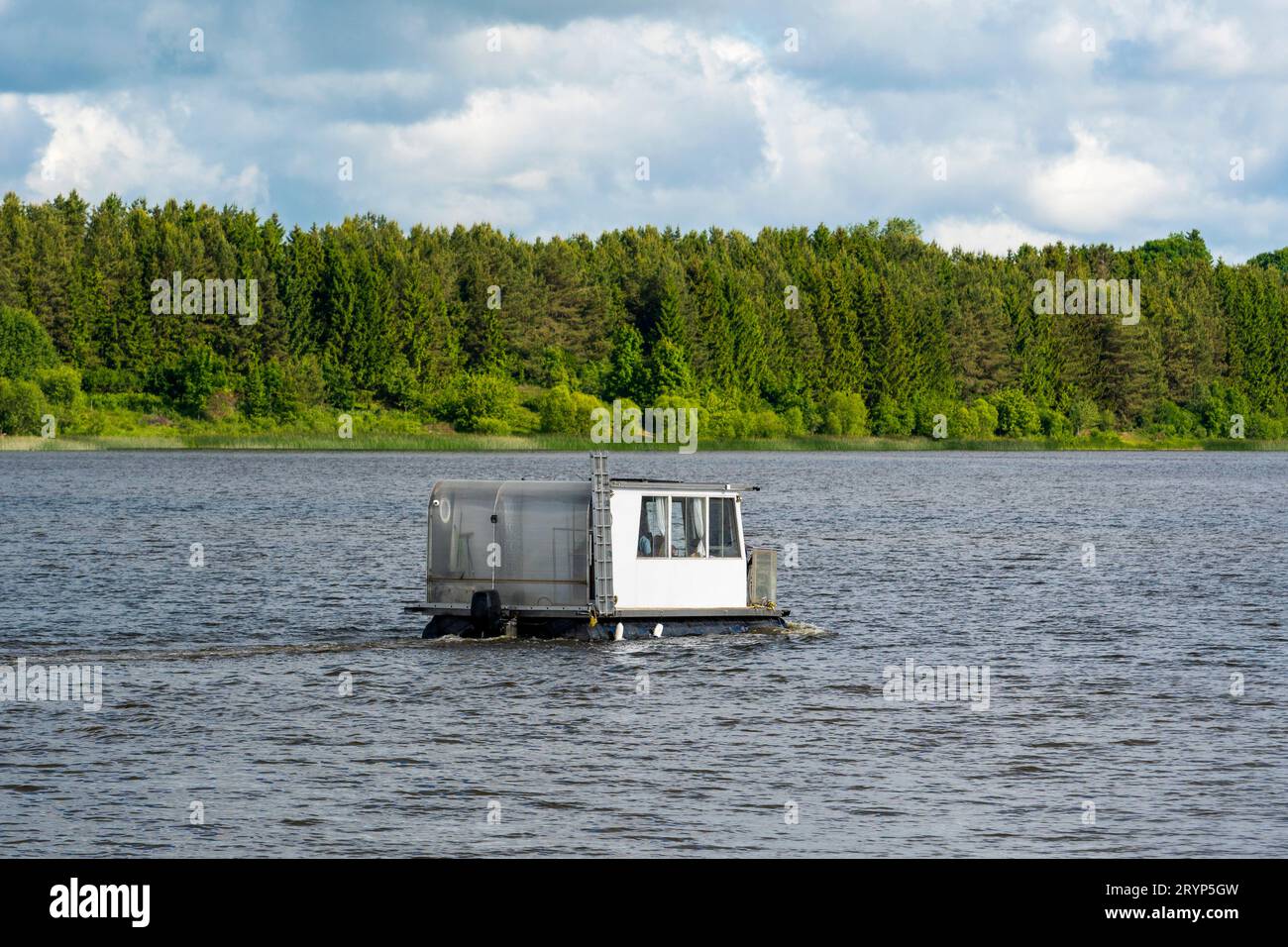 Small catamaran sailing with a passengers on the lake Stock Photo - Alamy