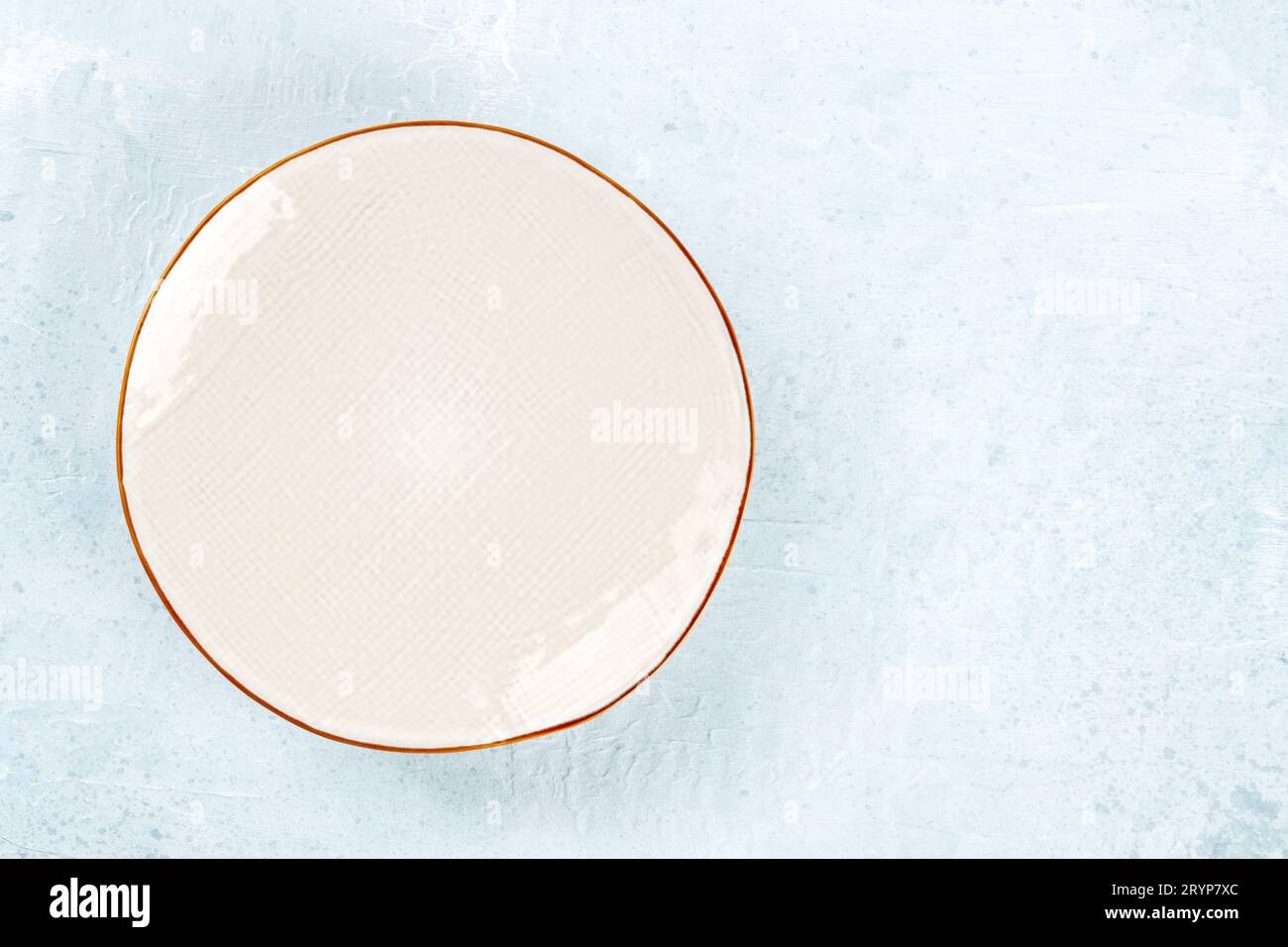 An empty white plate with a gold rim, overhead flat lay shot Stock ...