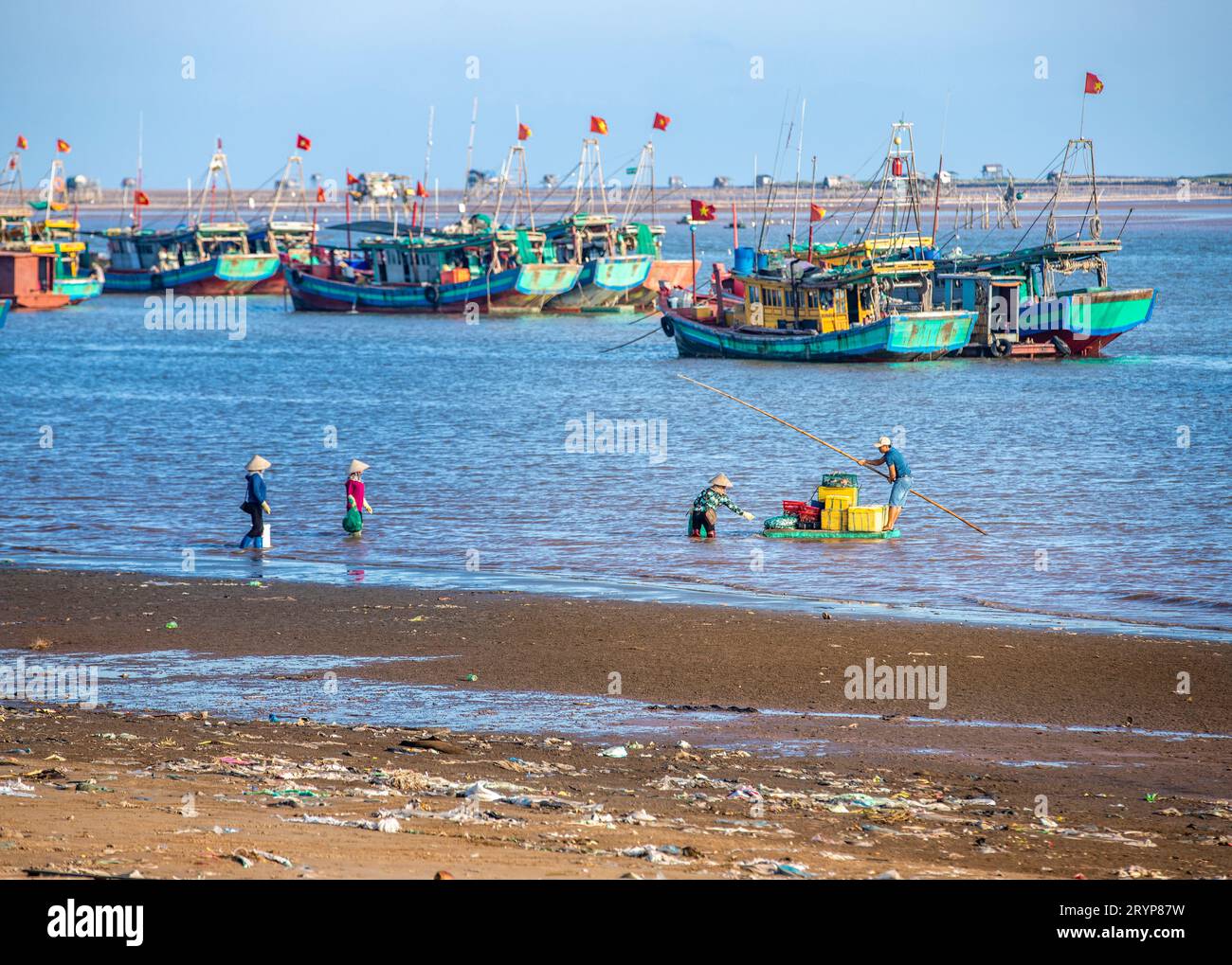 People in a fish market on beach Stock Photo - Alamy